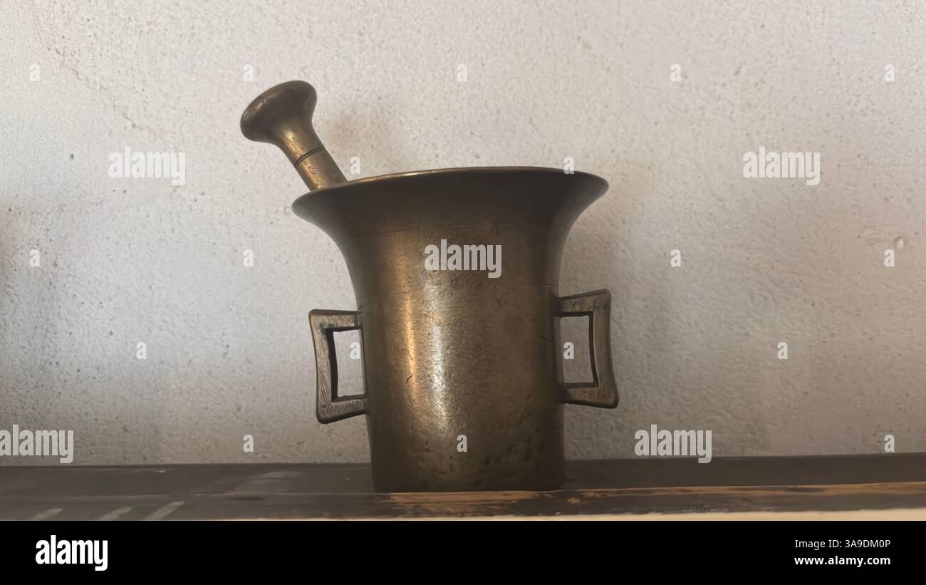 Vintage old metal bronze Mortar and pestle kitchen utensil. Traditional ...