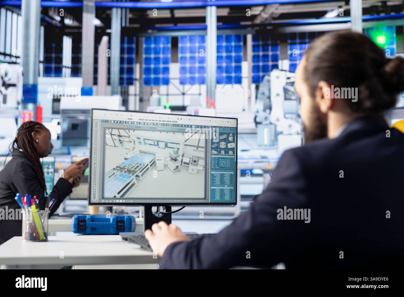 Photovoltaics factory industrial production manager looking over ...