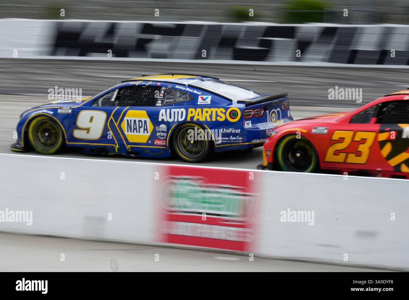 Chase Elliott (9) leads Bubba Wallace (23) into Turn 2 during a NASCAR ...