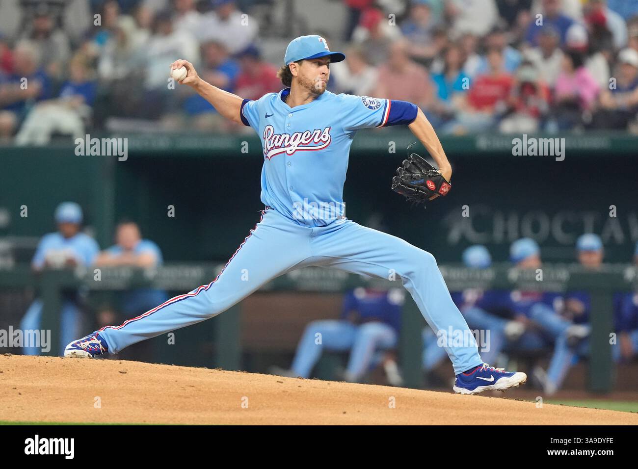 Texas Rangers starting pitcher Jacob deGrom throws during the fifth inning of a baseball game ...