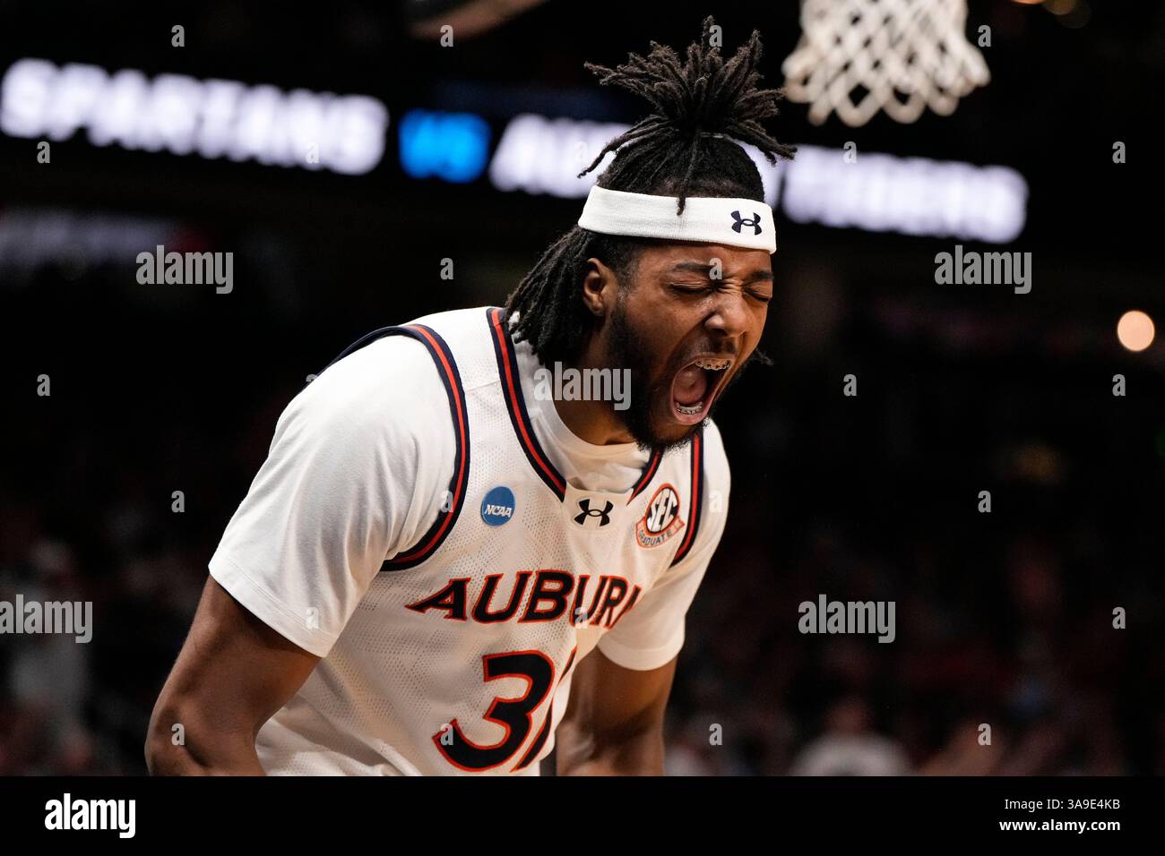 Auburn forward Chaney Johnson (31) reacts to a basket against Michigan ...