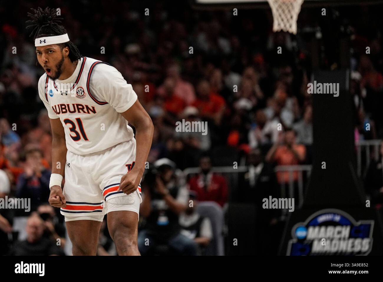 Auburn forward Chaney Johnson (31) reacts to play against Michigan ...