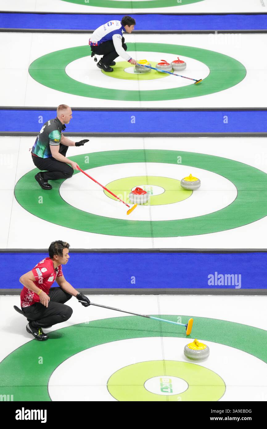 Canada's skip Brad Jacobs (centre) lines up a stone as Czechia's skip Lukas Klima (top) and ...