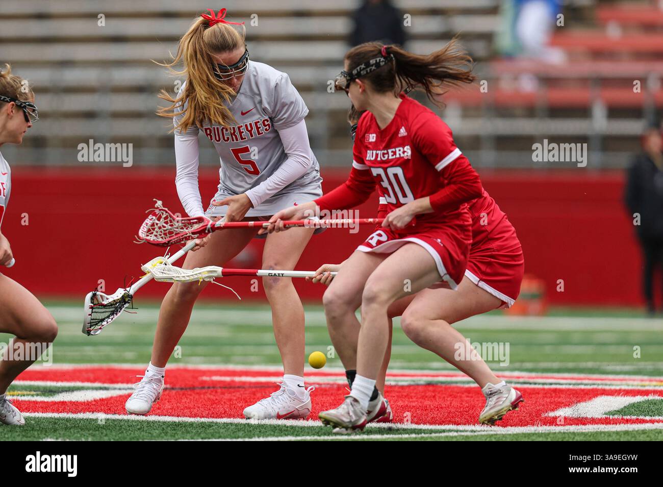 March 30, 2025: Ohio St. midfielder Abby Boyle (5) tries to get the ...