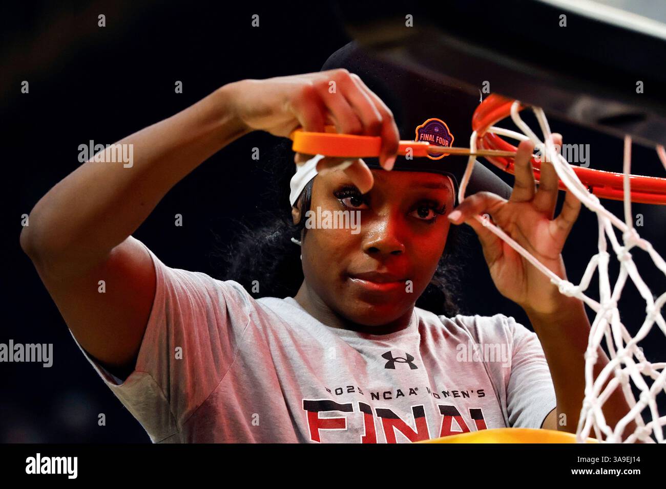South Carolina guard Raven Johnson cuts down the net after her team ...