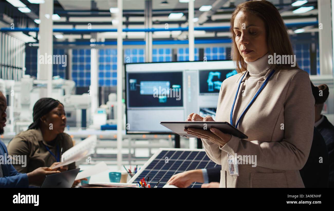 Happy researcher analyzes solar cell prototypes using tablet to ...