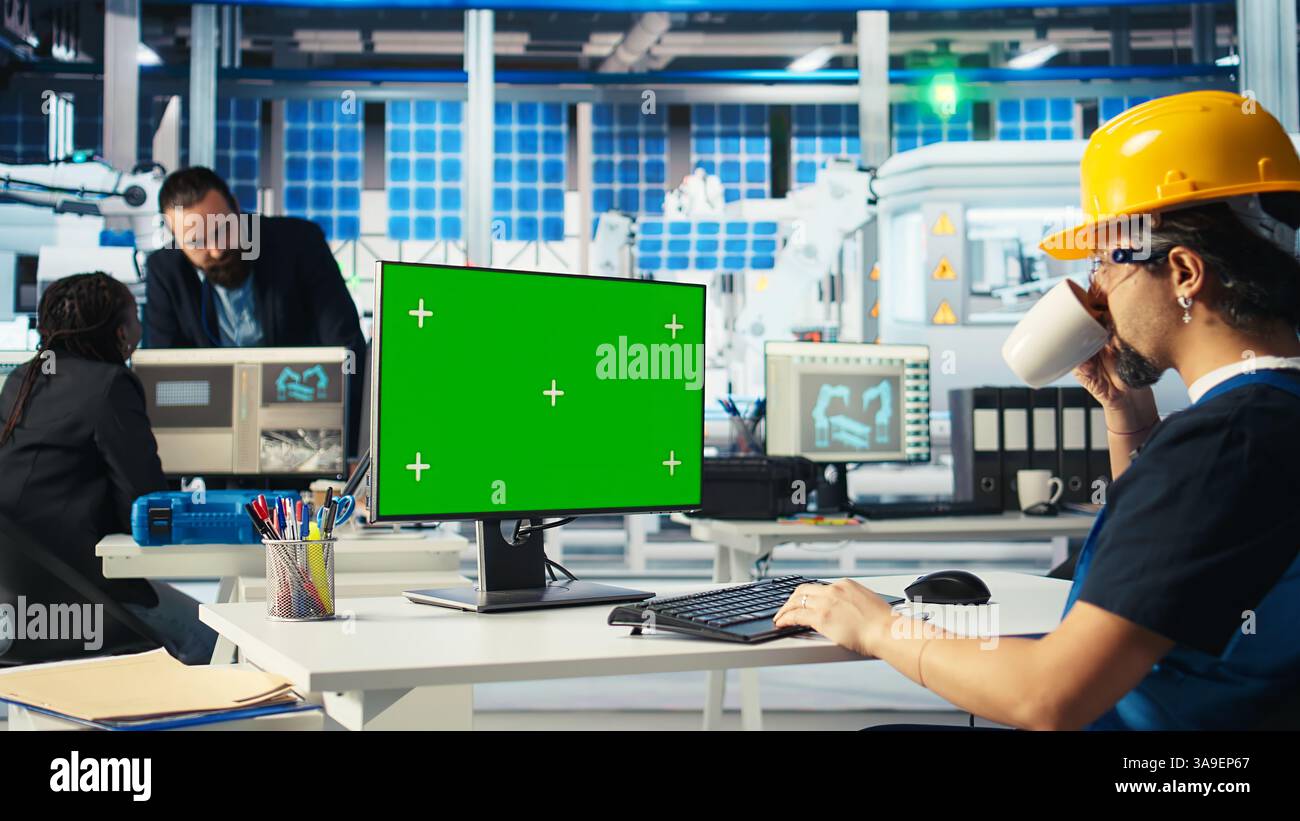 Engineer in solar panels plant using CAD software on mockup PC to ...