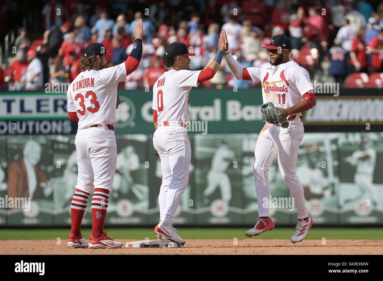 St. Louis Cardinals' Victor Scott II (11), Masyn Winn (0) and Brendan ...