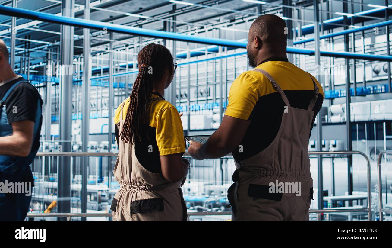 Industry 4.0 industrial plant engineering team controlling automated ...