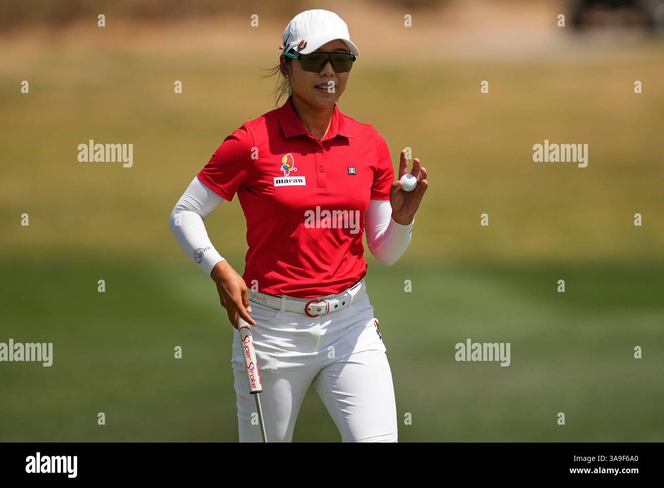 Mi Hyang Lee, of South Korea, waves on the third green during the final ...
