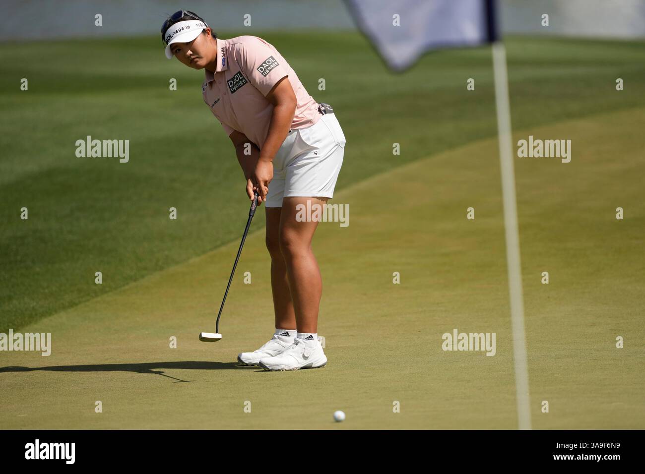 Haeran Ryu, of South Korea, puts on the third green during the final ...