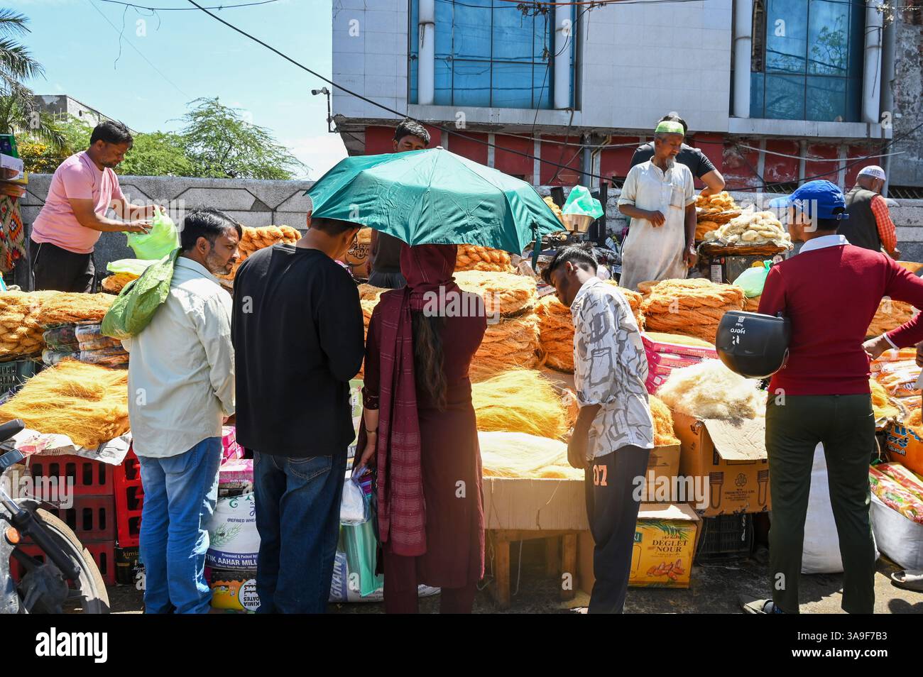 NOIDA, INDIA - MARCH 30: People shop at the Sector 8 market on the eve ...