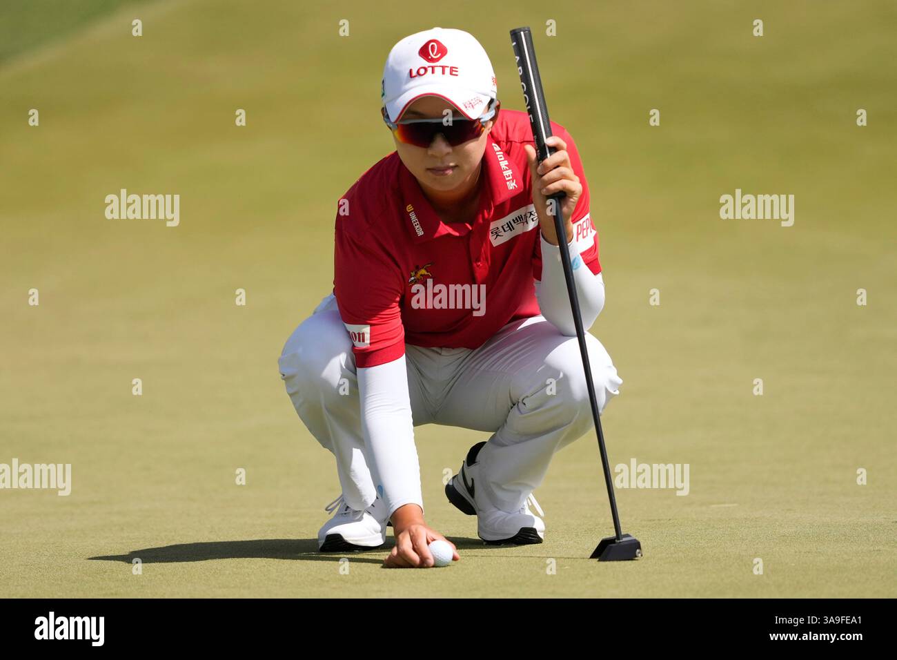Hyo Joo Kim, of South Korea, lines up her shot on the third green ...