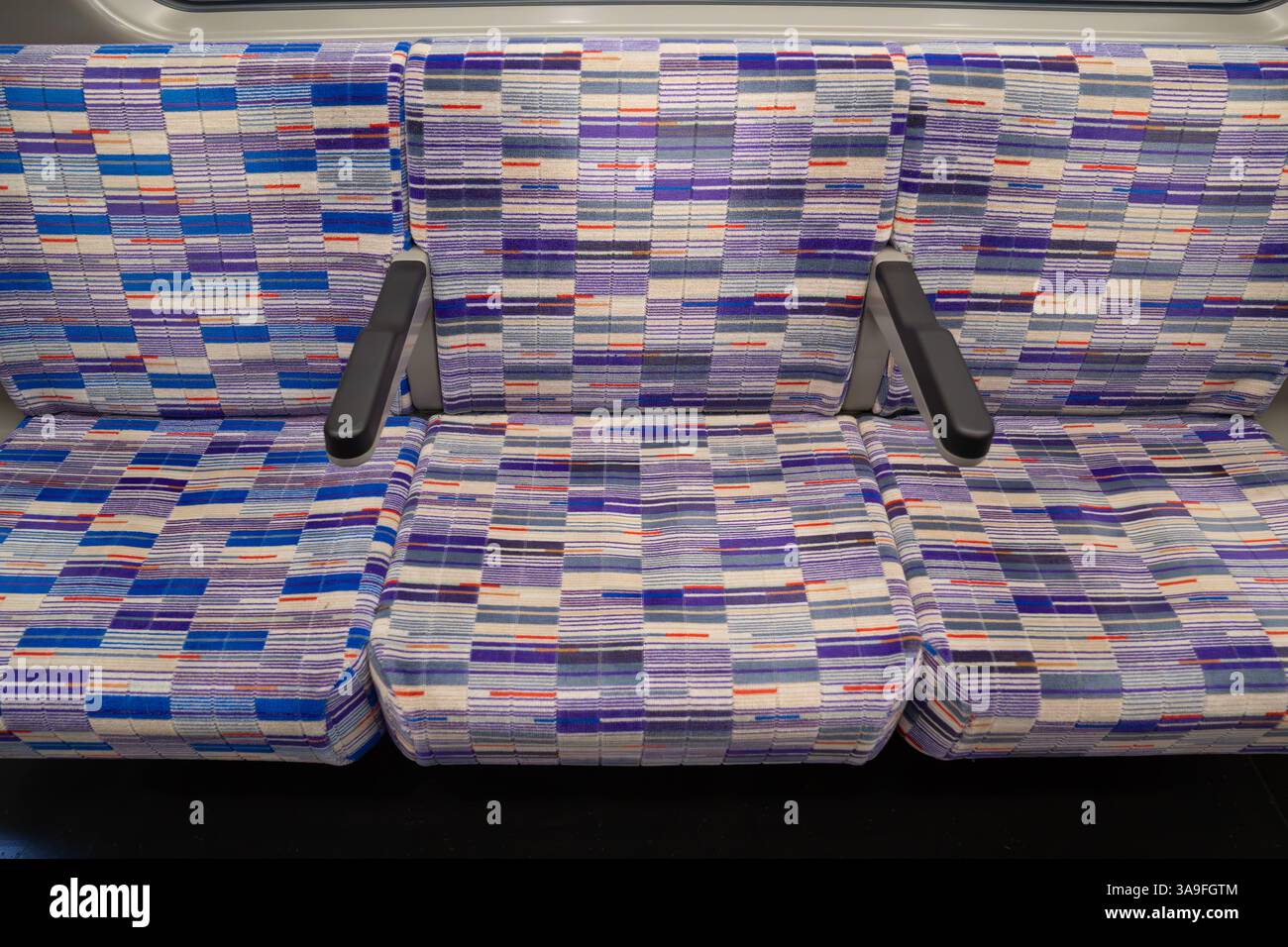 patterned purple seats inside the Elizabeth Line train showcases their ...