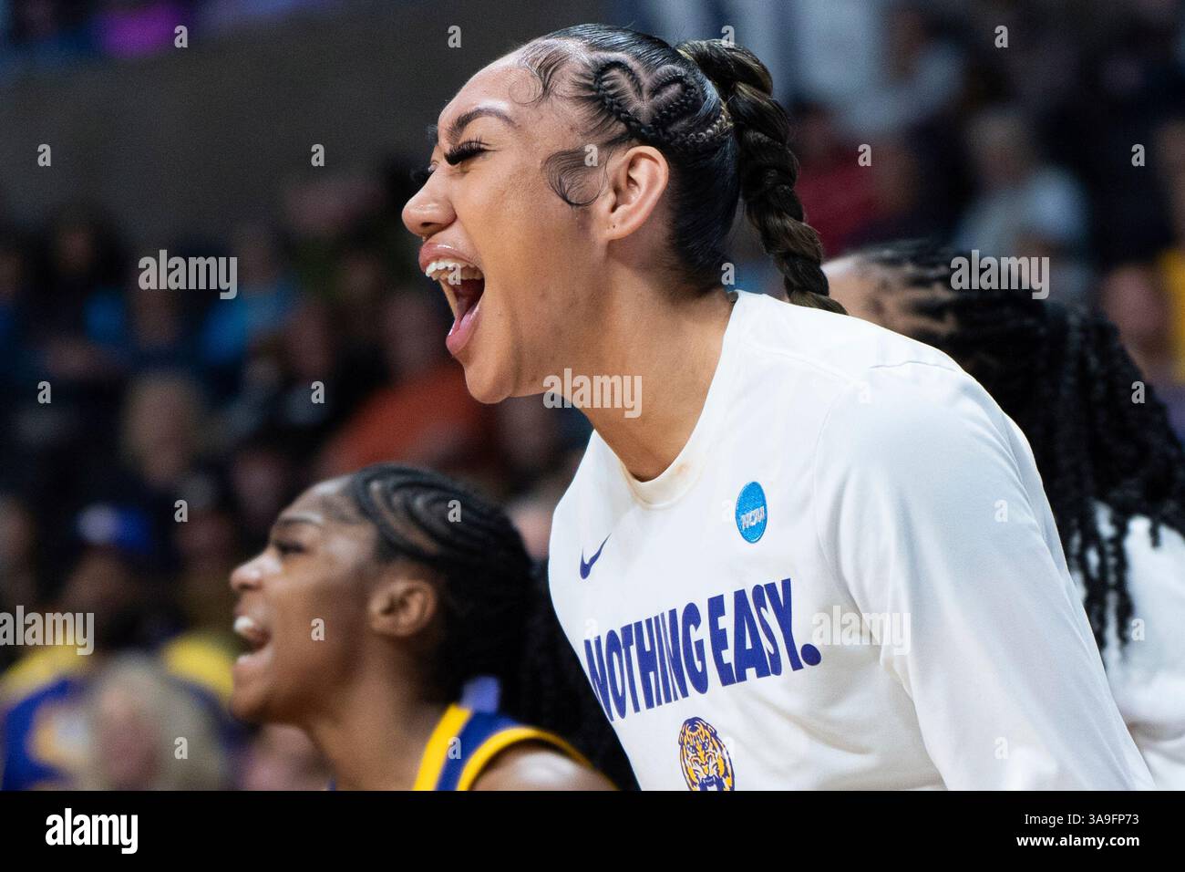LSU guard Last-Tear Poa (13) yells during the first half of a game ...