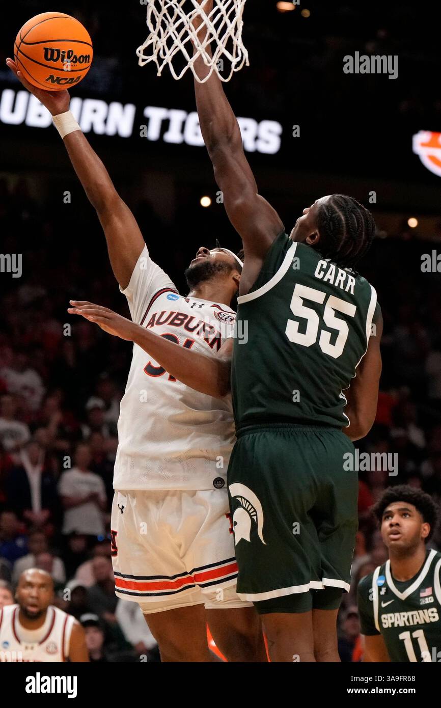 Auburn forward Chaney Johnson (31) shoots against Michigan State ...