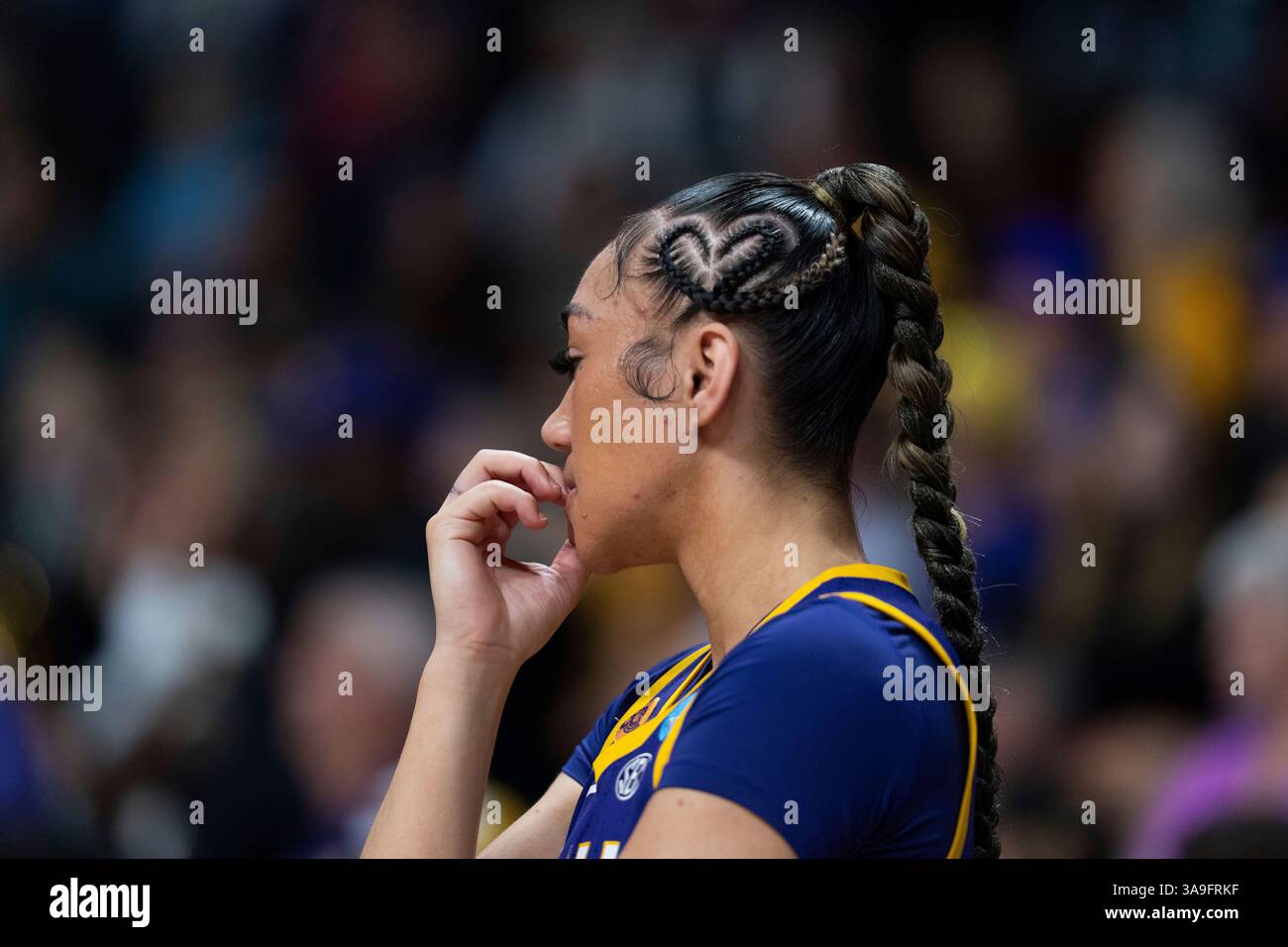 LSU guard Last-Tear Poa bites her nail during the second half of a game ...