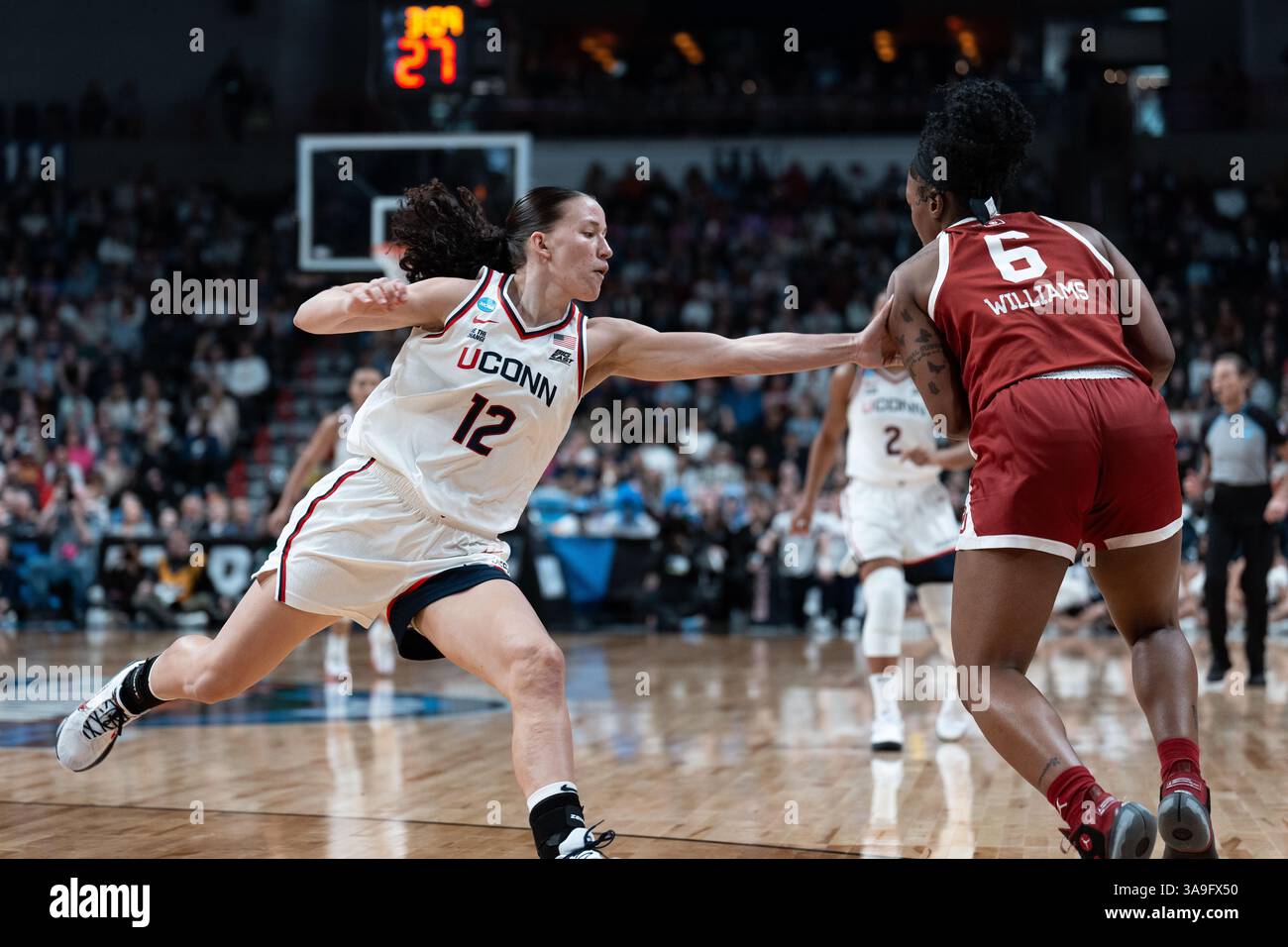 UConn Huskies guard Ashlynn Shade (12) fouls Oklahoma Sooners forward ...
