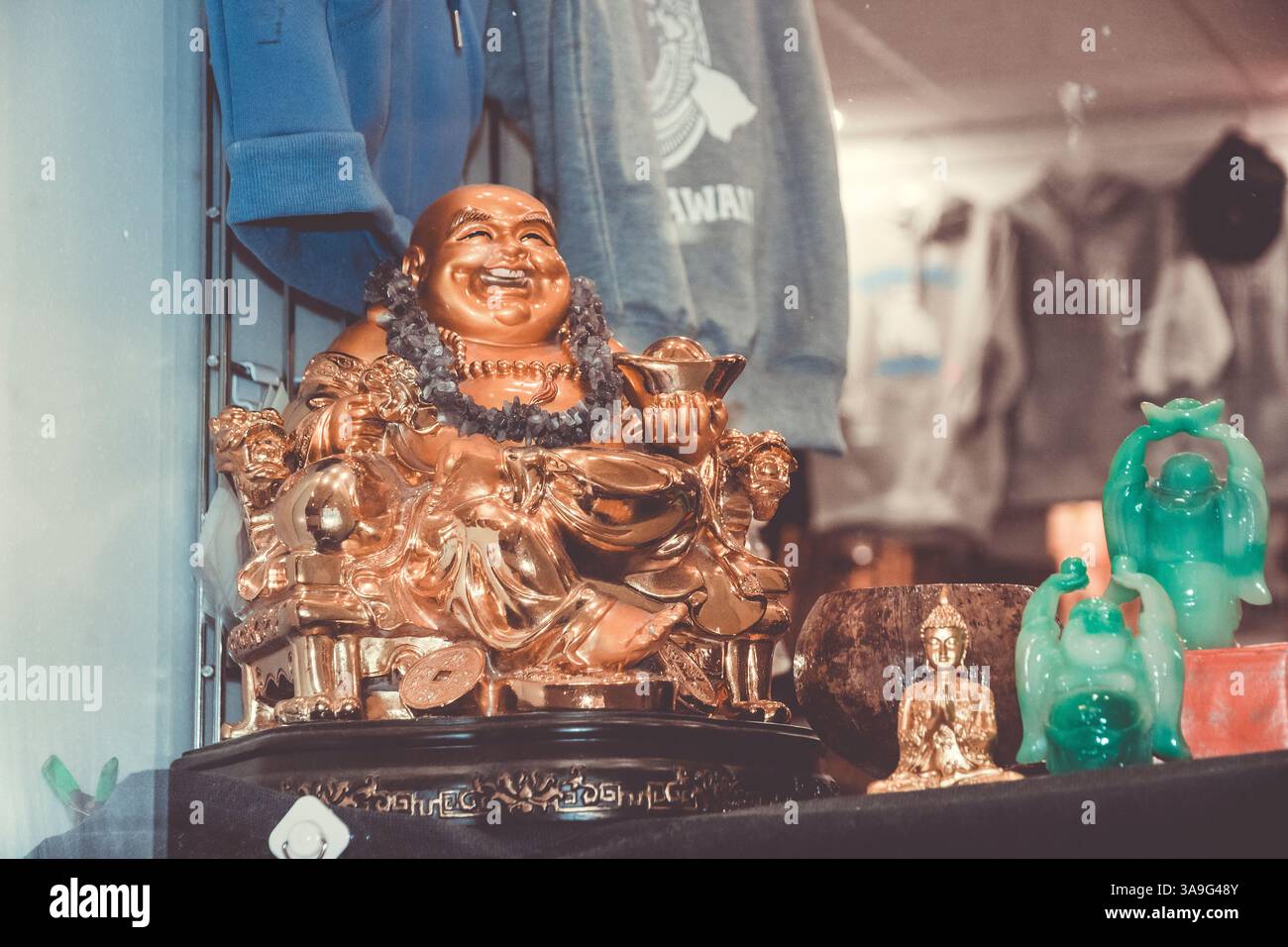Oahu, Hawaii, USA - February 23, 2024 - Store window with laughing ...