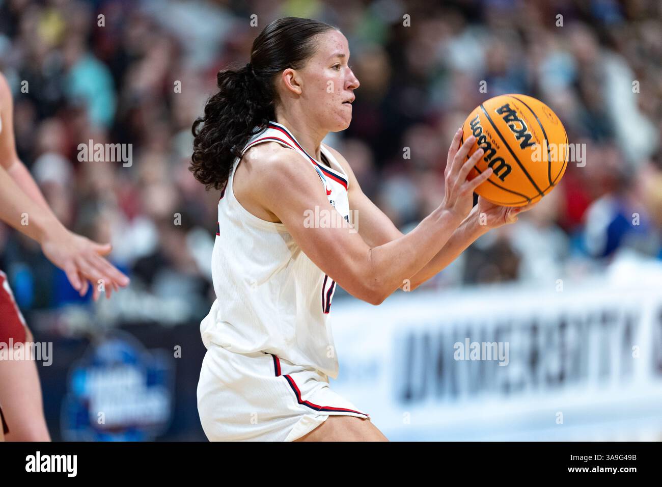 UConn Huskies guard Ashlynn Shade (12) passes the ball against the ...