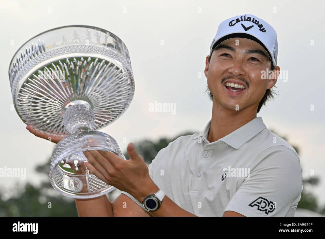 HOUSTON, TX - MARCH 30: Min Woo Lee (AUS) holds the trophy for winning ...