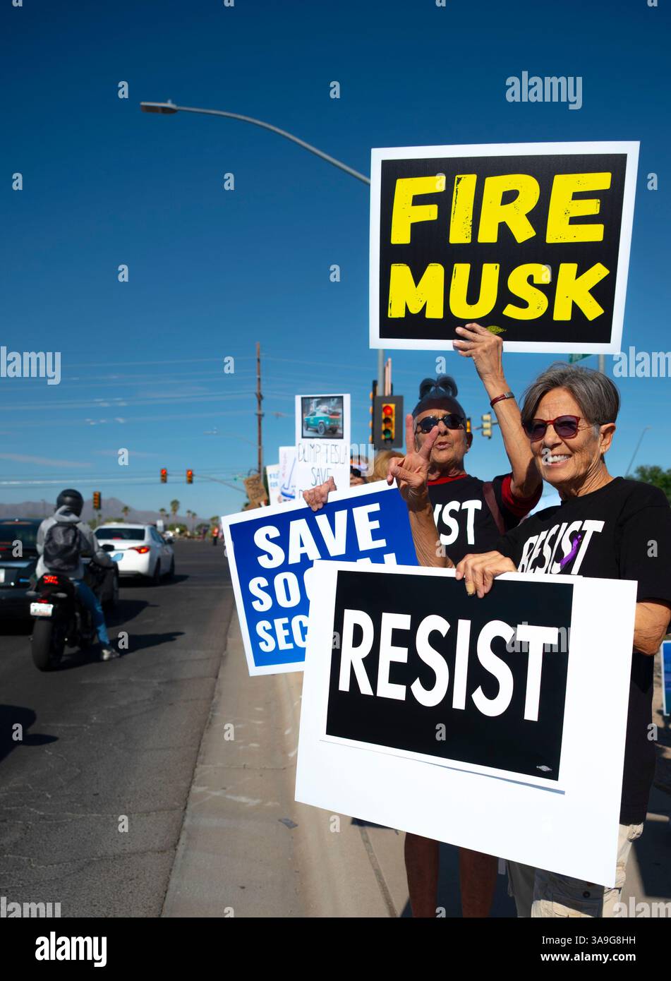 Protesters with placards deriding Elon Musk and Trump Administration's ...