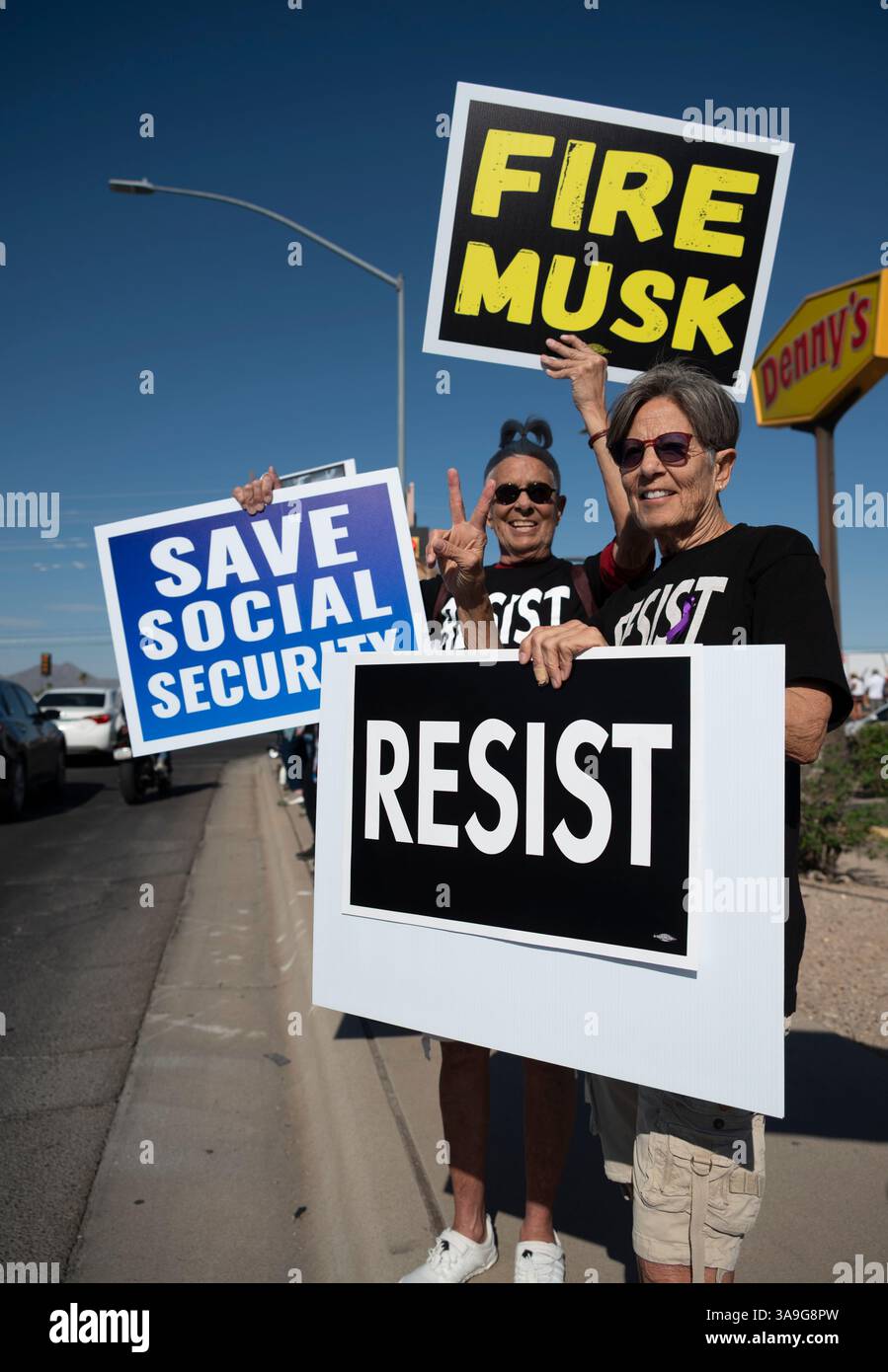 Protesters with placards deriding Elon Musk and Trump Administration's ...