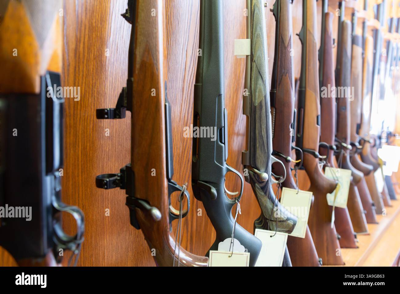 Gun store interior with rifles on showcase Stock Photo - Alamy