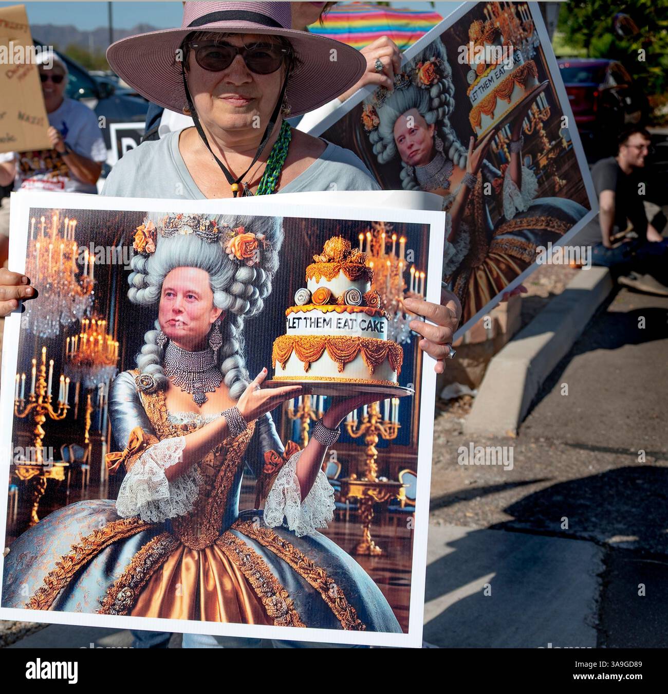 Protesters with placards deriding Elon Musk and Trump Administration's ...