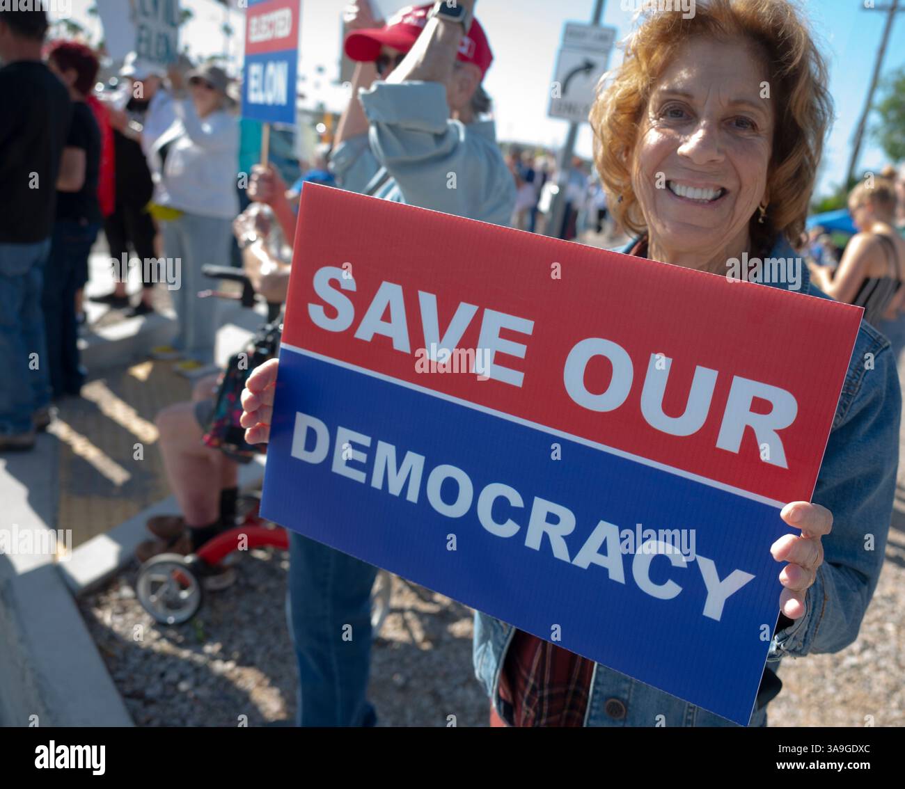 Protesters with placards deriding Elon Musk and Trump Administration's ...
