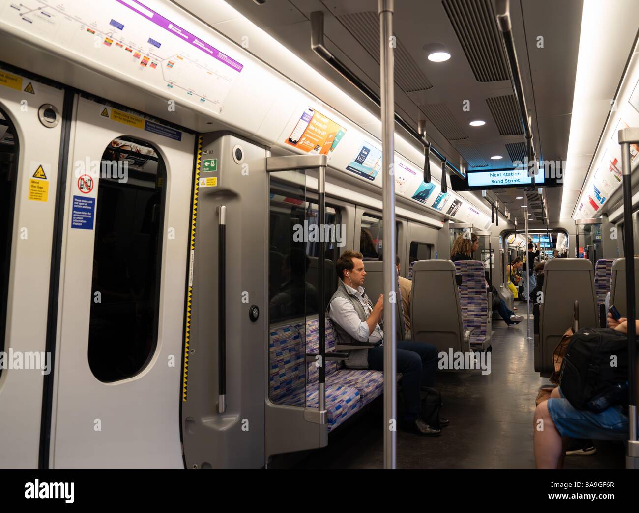 London, England, 11 July 2023, Passengers Ride an Elizabeth Line Train ...