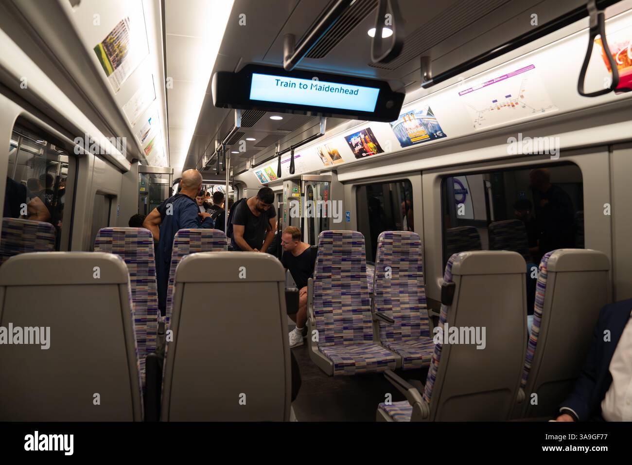 London, England, 11 July 2023, Passengers Ride an Elizabeth Line Train ...