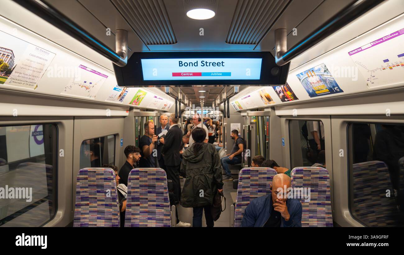London, England, 11 July 2023, Passengers Ride an Elizabeth Line Train ...