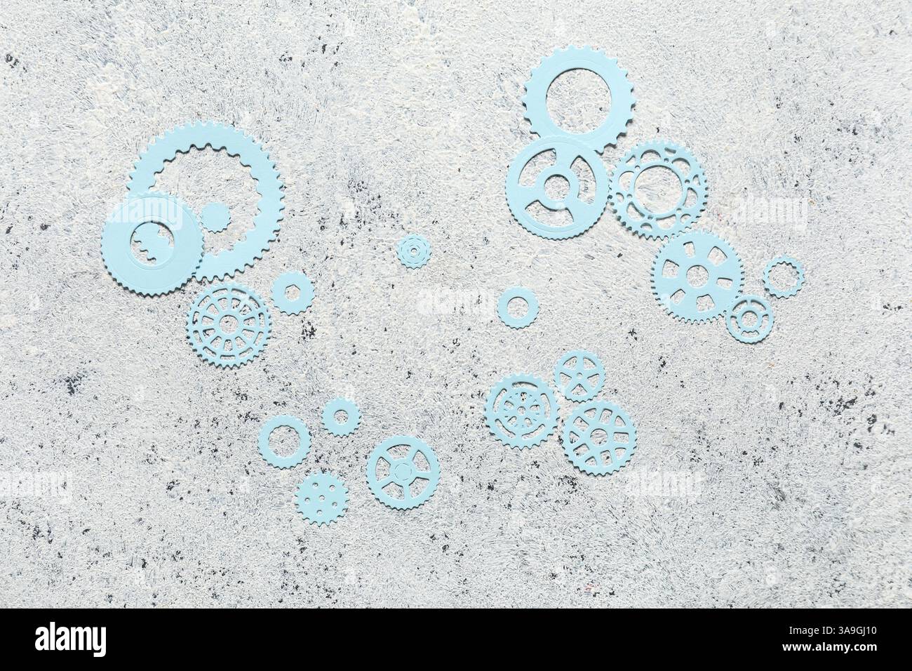 Blue paper gears on white background Stock Photo - Alamy