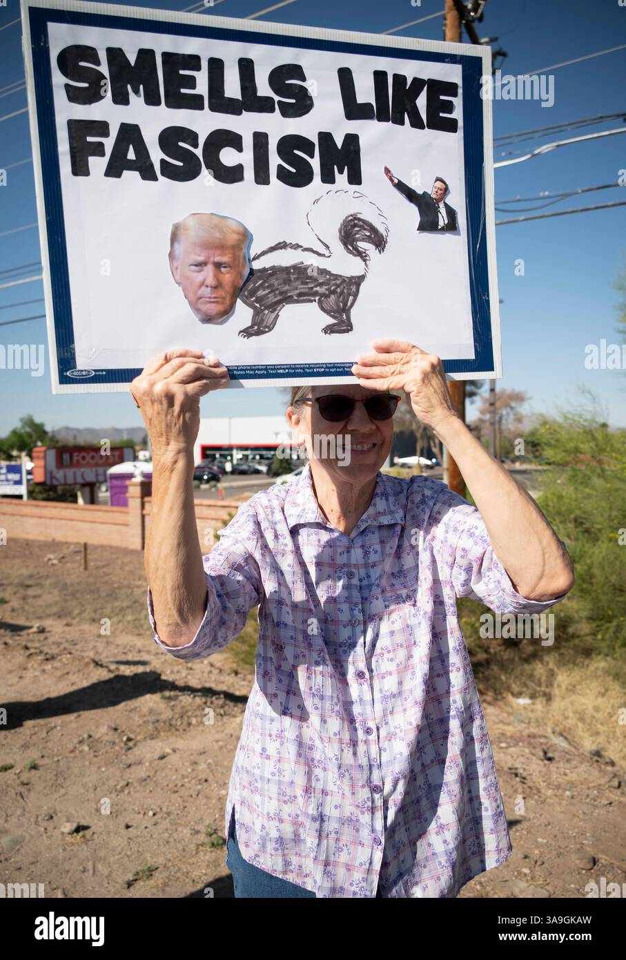 Protester with placards claims "Smells like Fascism" with skunk Trump ...
