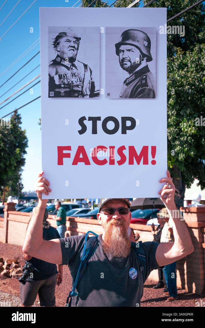 Protesters with placards deriding Elon Musk and Trump Administration's ...
