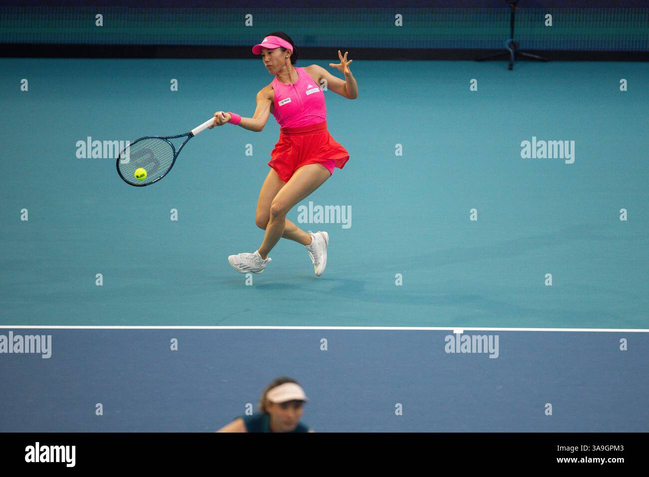 Miyu Kato of Japan returns the ball in the Women's Doubles Final during ...