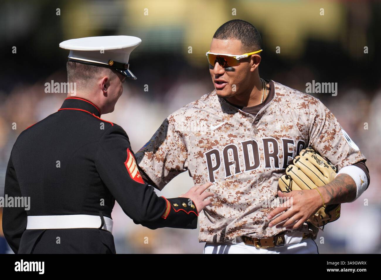 San Diego Padres third baseman Manny Machado greets a Marine before the ...