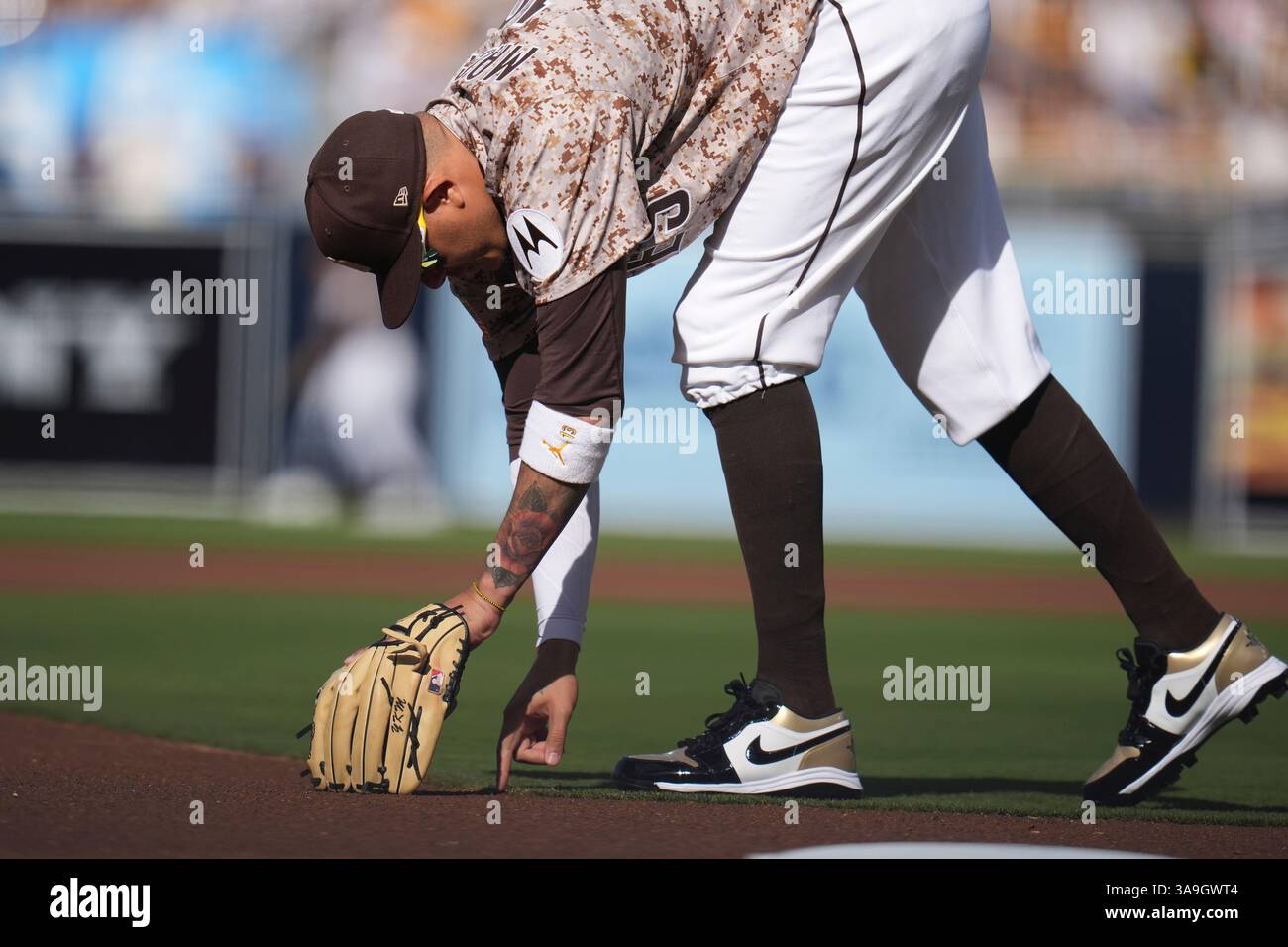 San Diego Padres third baseman Manny Machado draws in the infield dirt ...