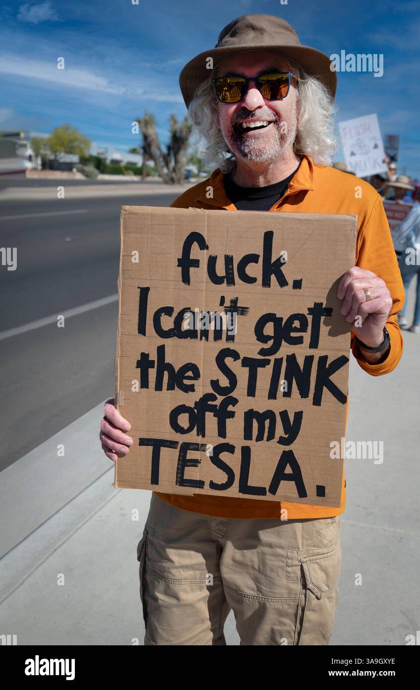 Protesters with placards deriding Elon Musk and Trump Administration's ...