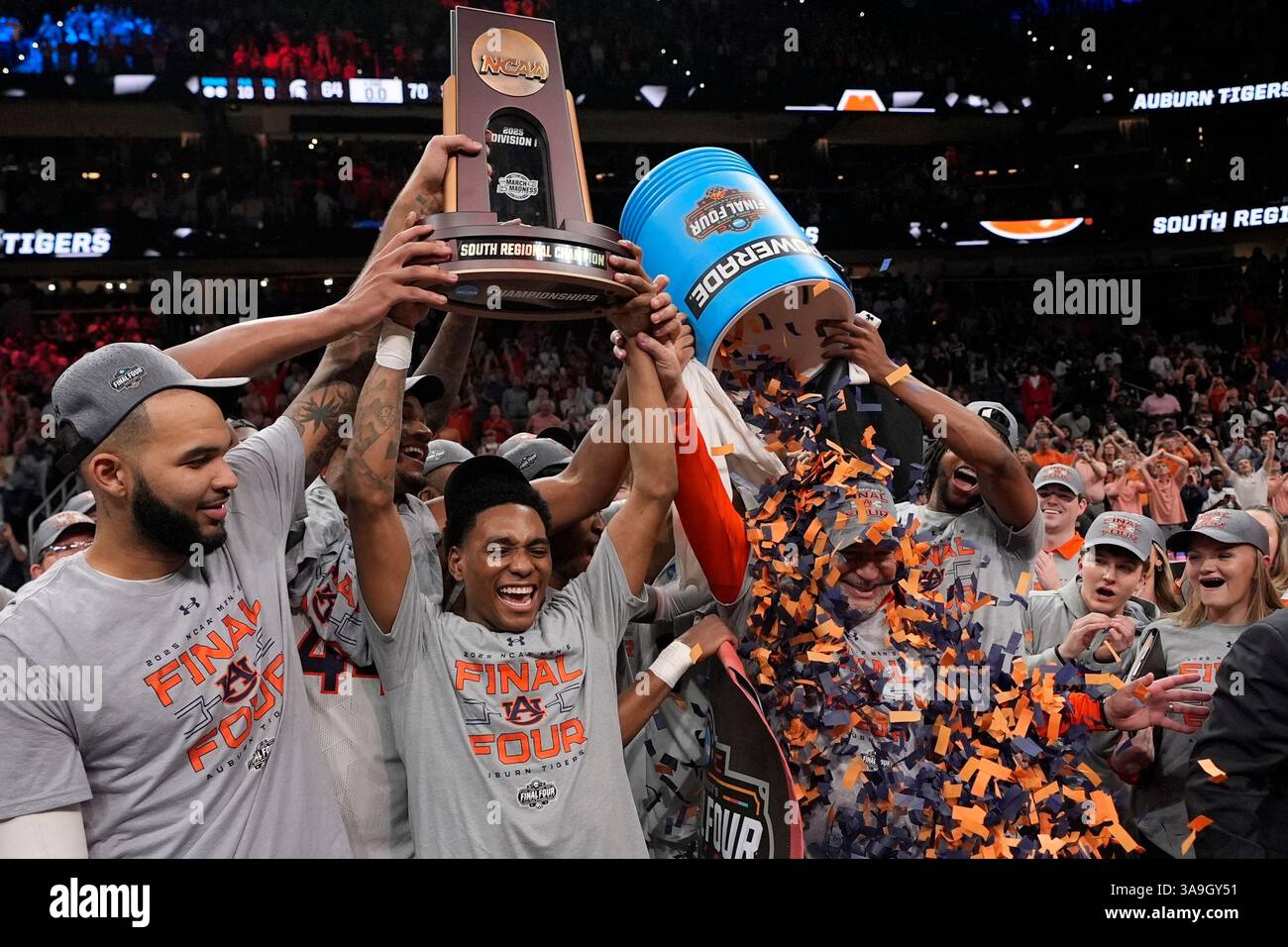 Auburn Head Coach Bruce Pearl And Players Celebrate A Win Over Michigan