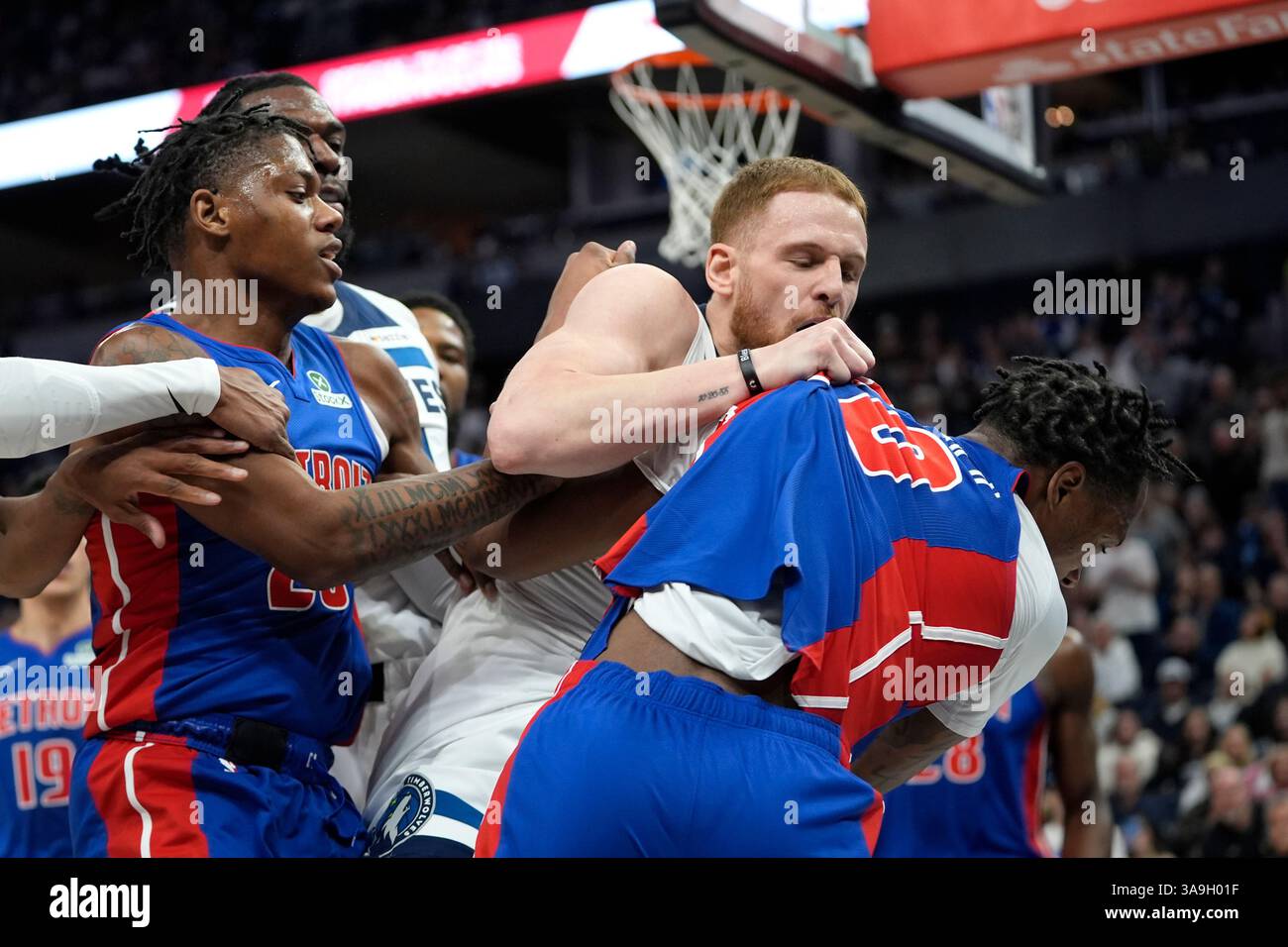 Minnesota Timberwolves guard Donte DiVincenzo (0), middle, and Detroit ...