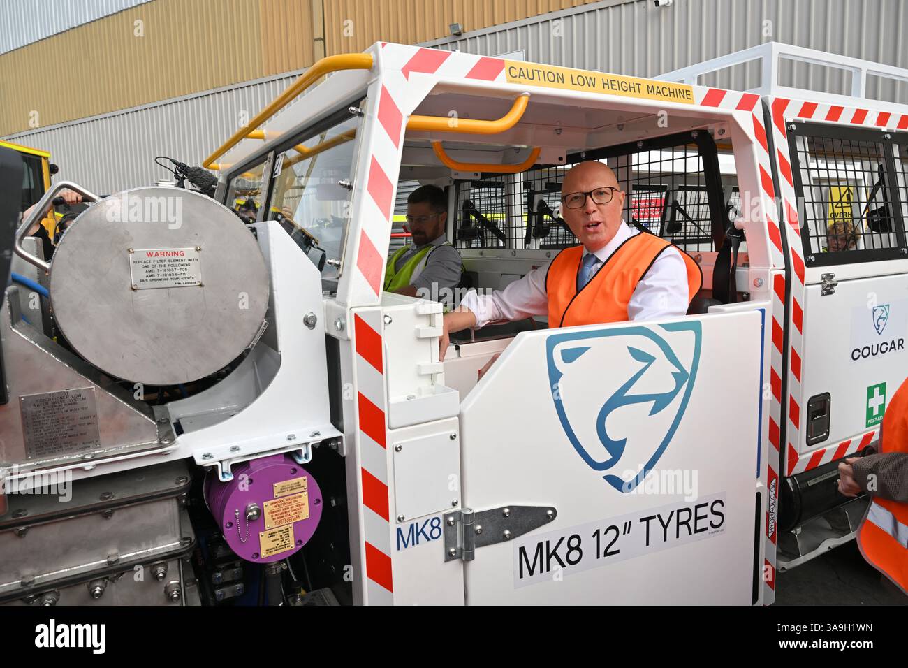 Leader of the Opposition Peter Dutton enters a mine cruiser during a ...