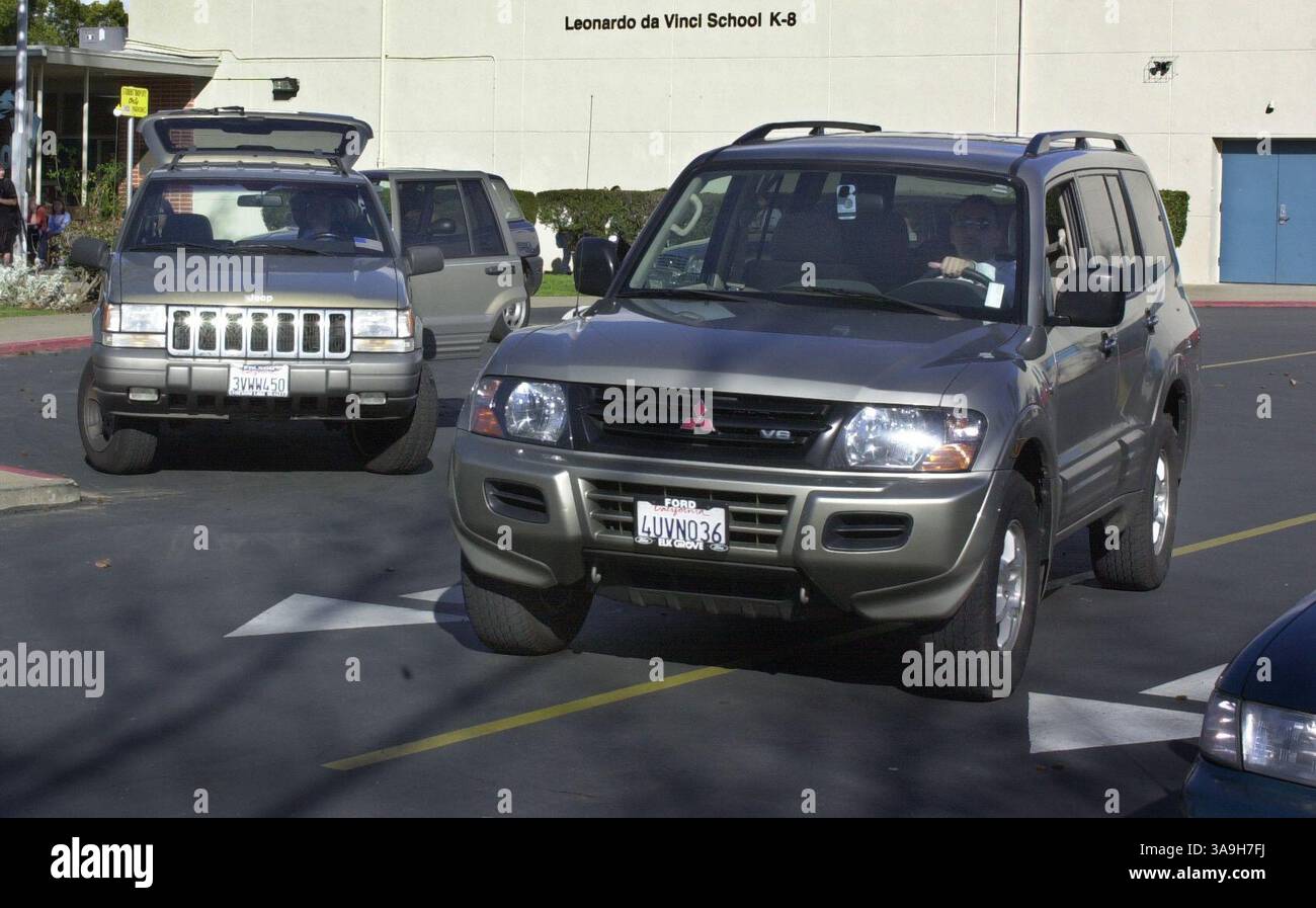SUV's and light trucks line up at Leonardo da Vinci K-8 School Thursday ...