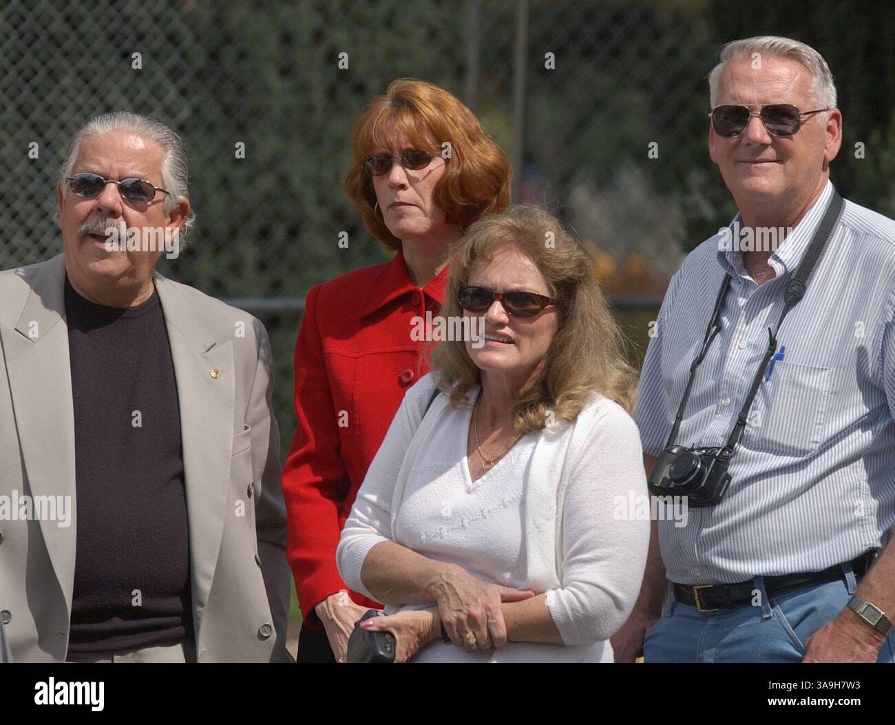 L-R, Dan with wife Linda Terry (cq) in red coat, of Sacramento and ...