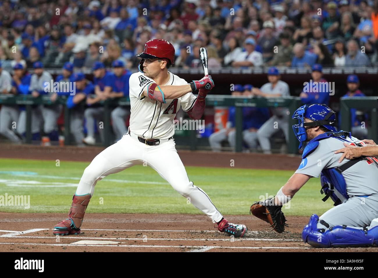 Arizona Diamondbacks' Corbin Carroll, left, starts his swing as Chicago ...