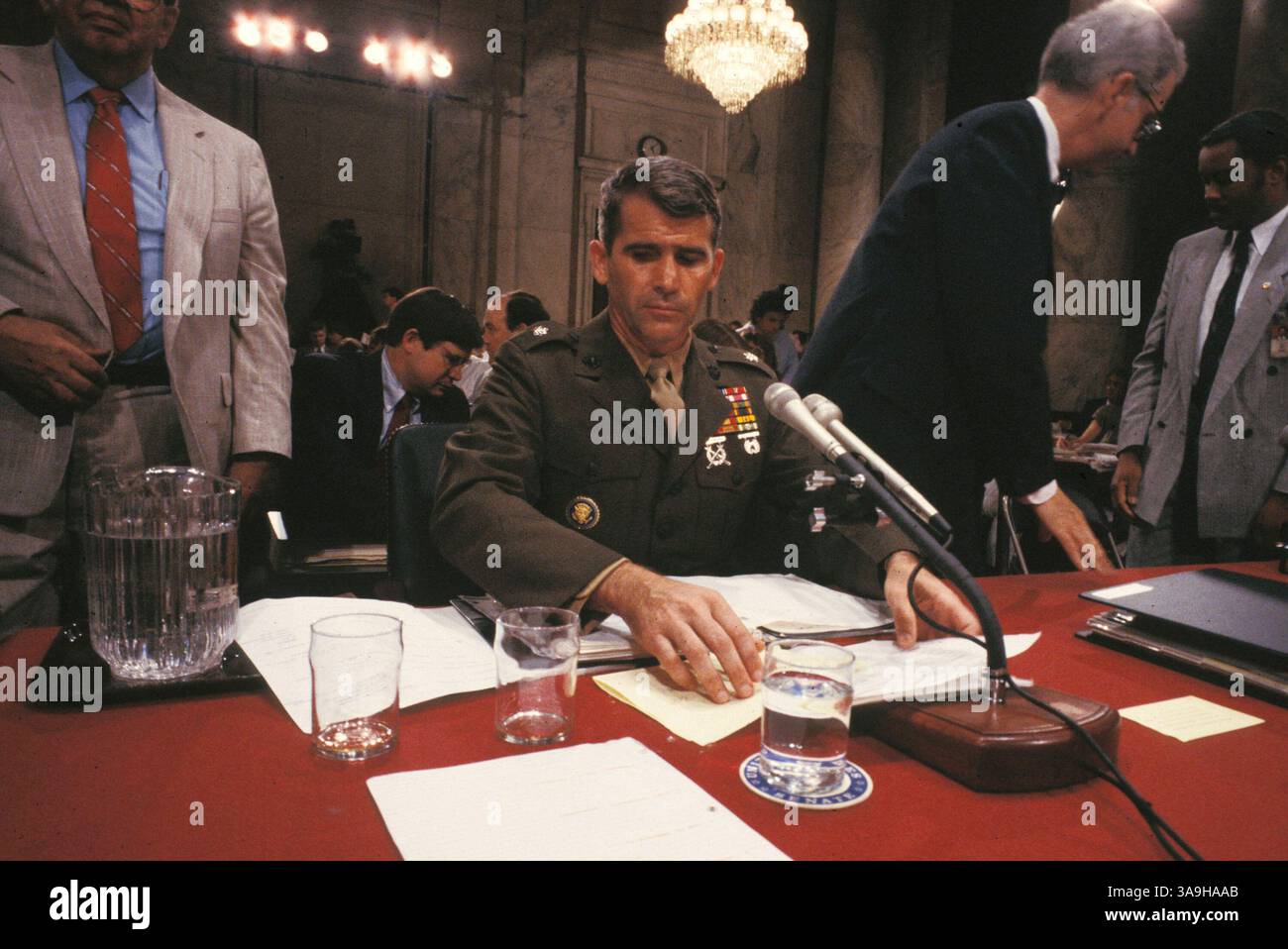 Jul 08, 1987; Washington DC, USA; Lt. Con. OLLIE NORTH looks through ...