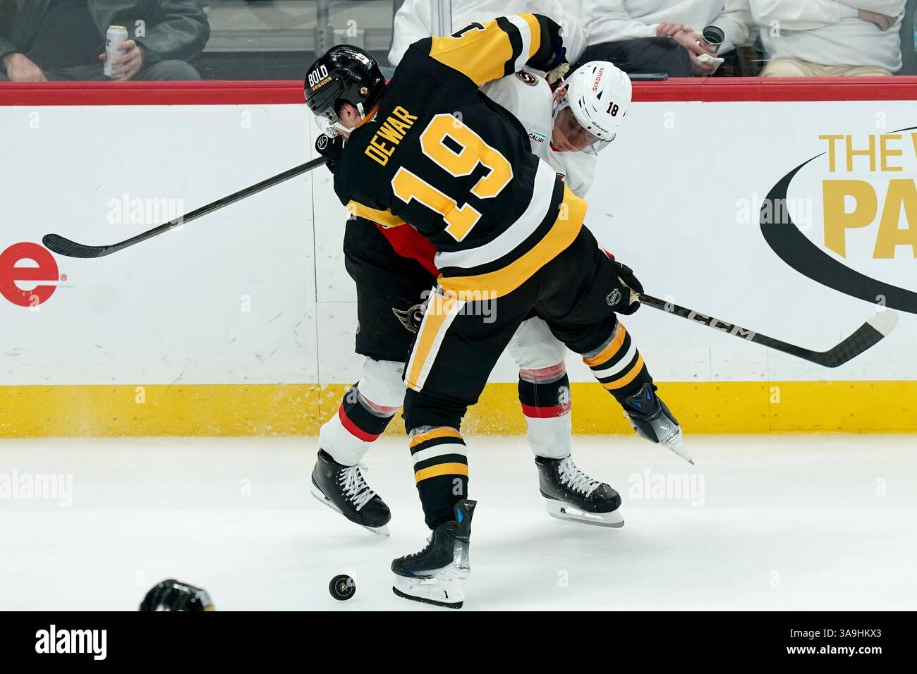 Pittsburgh Penguins' Connor Dewar (19) collides with Ottawa Senators ...