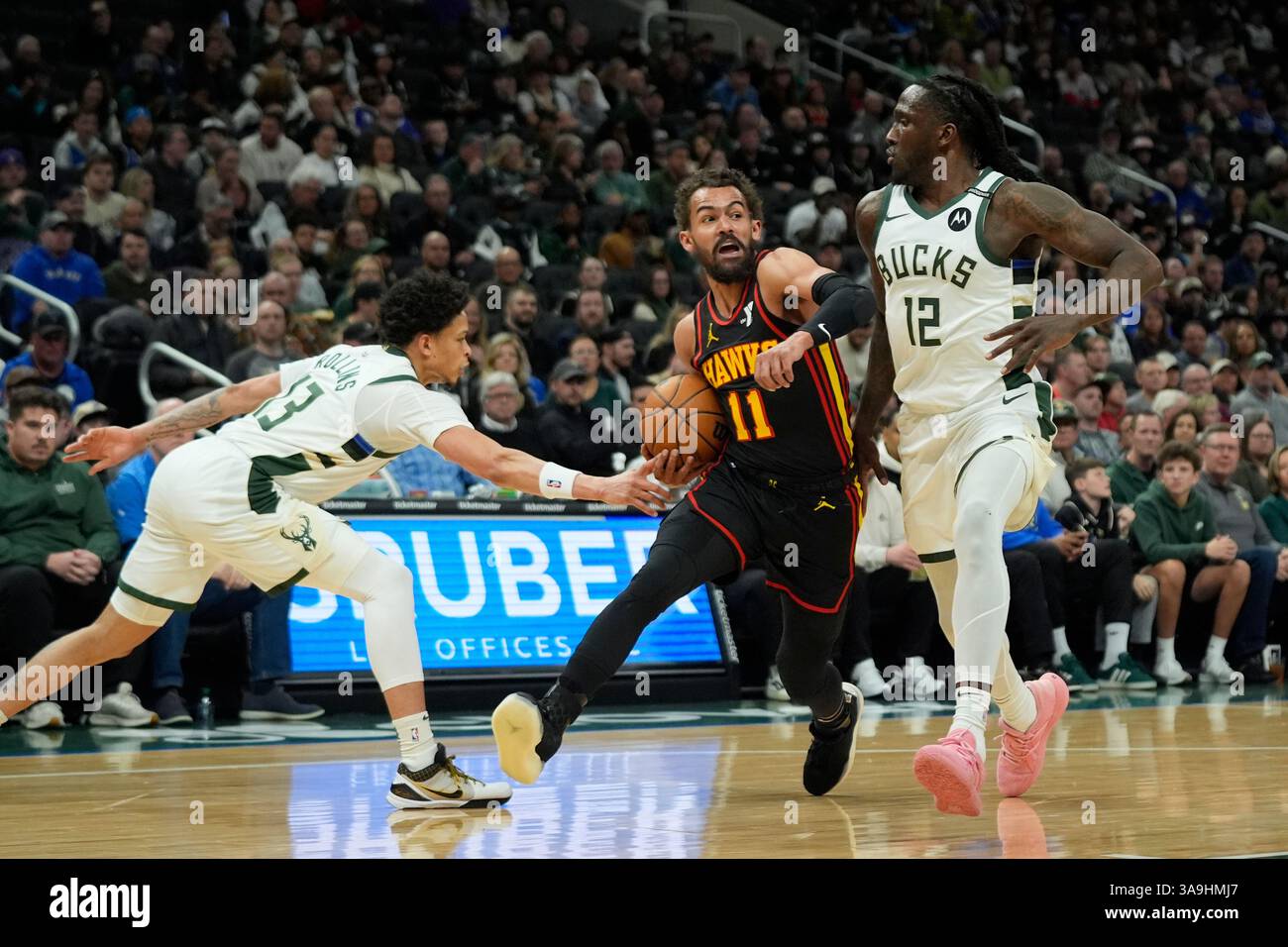 Atlanta Hawks' Trae Young (11) drives to the basket between Milwaukee ...