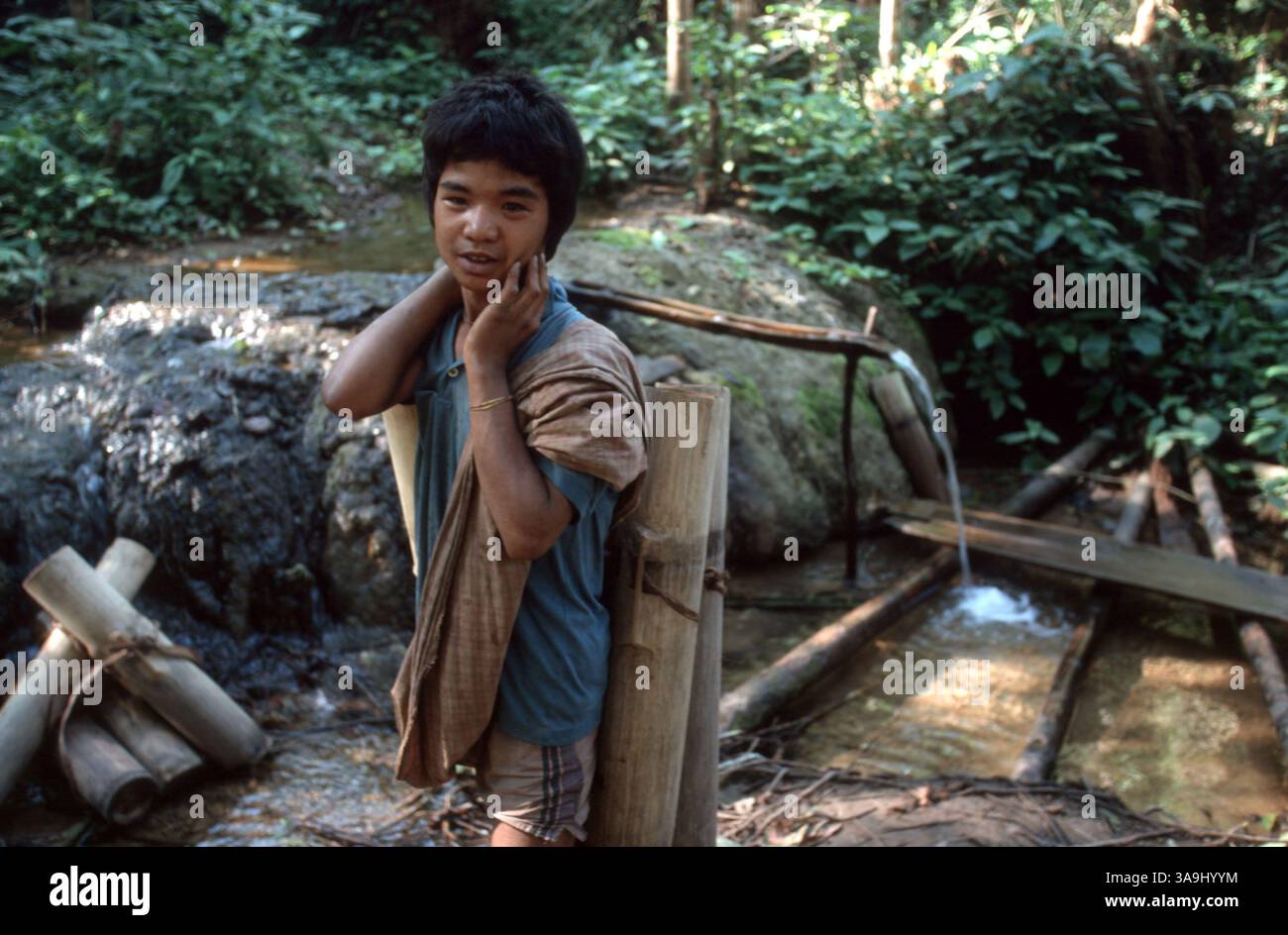 Jan 05, 2000; Paan District, Karen, Burma; Refugees collect water ...